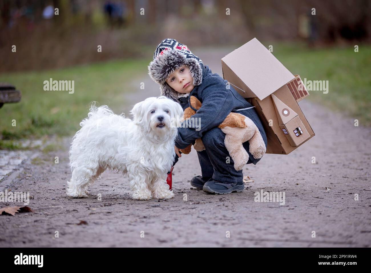 Little child, blond boy with pet dog, carying home on his back, kid ...