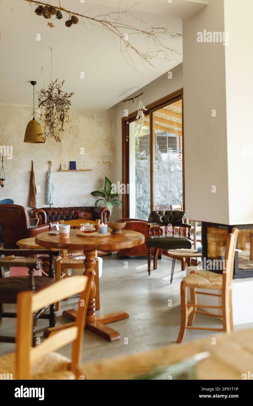 Scandinavian interior style, warm fireplace with armchair in front ...