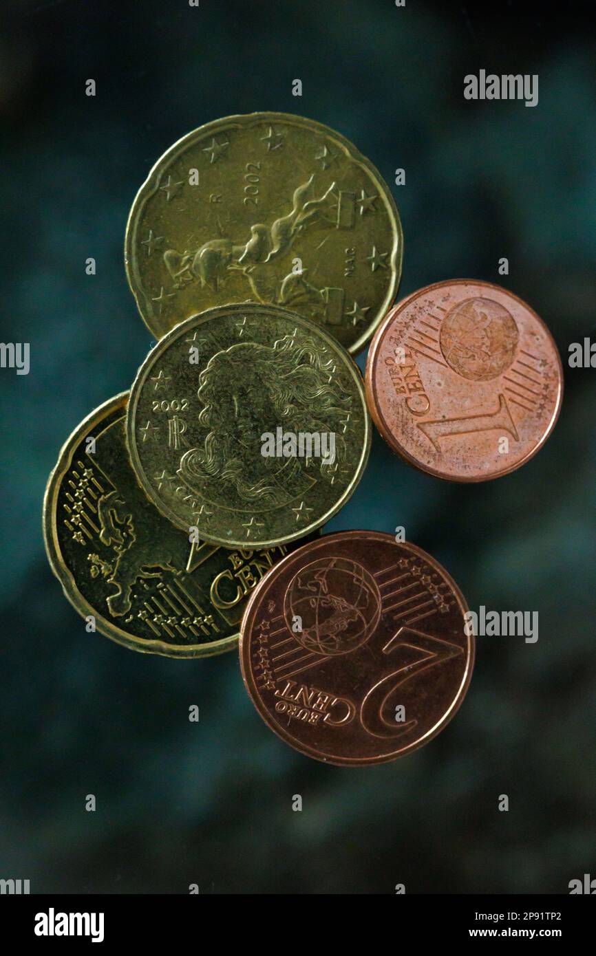 top view on five different Euro coins lying on a glass table Stock ...