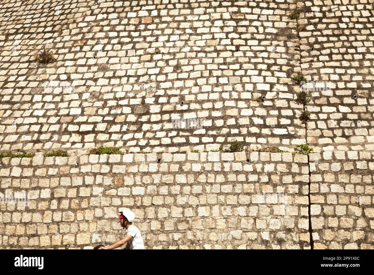 Person passing old brick hi-res stock photography and images - Alamy