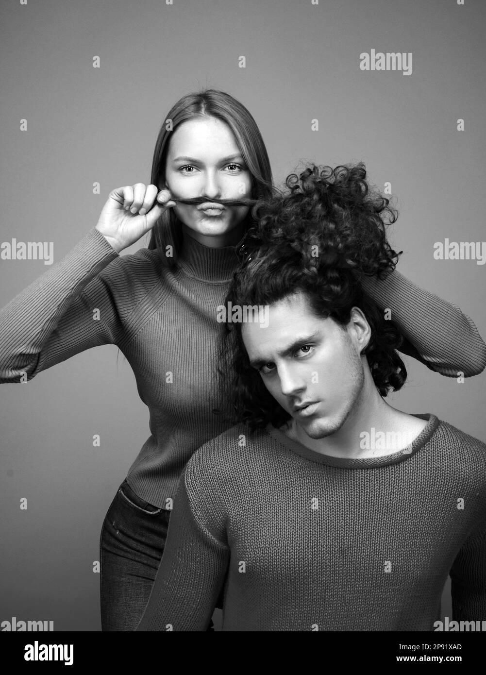 Beautiful girl playing with her boyfriend hair. Different types of hair ...