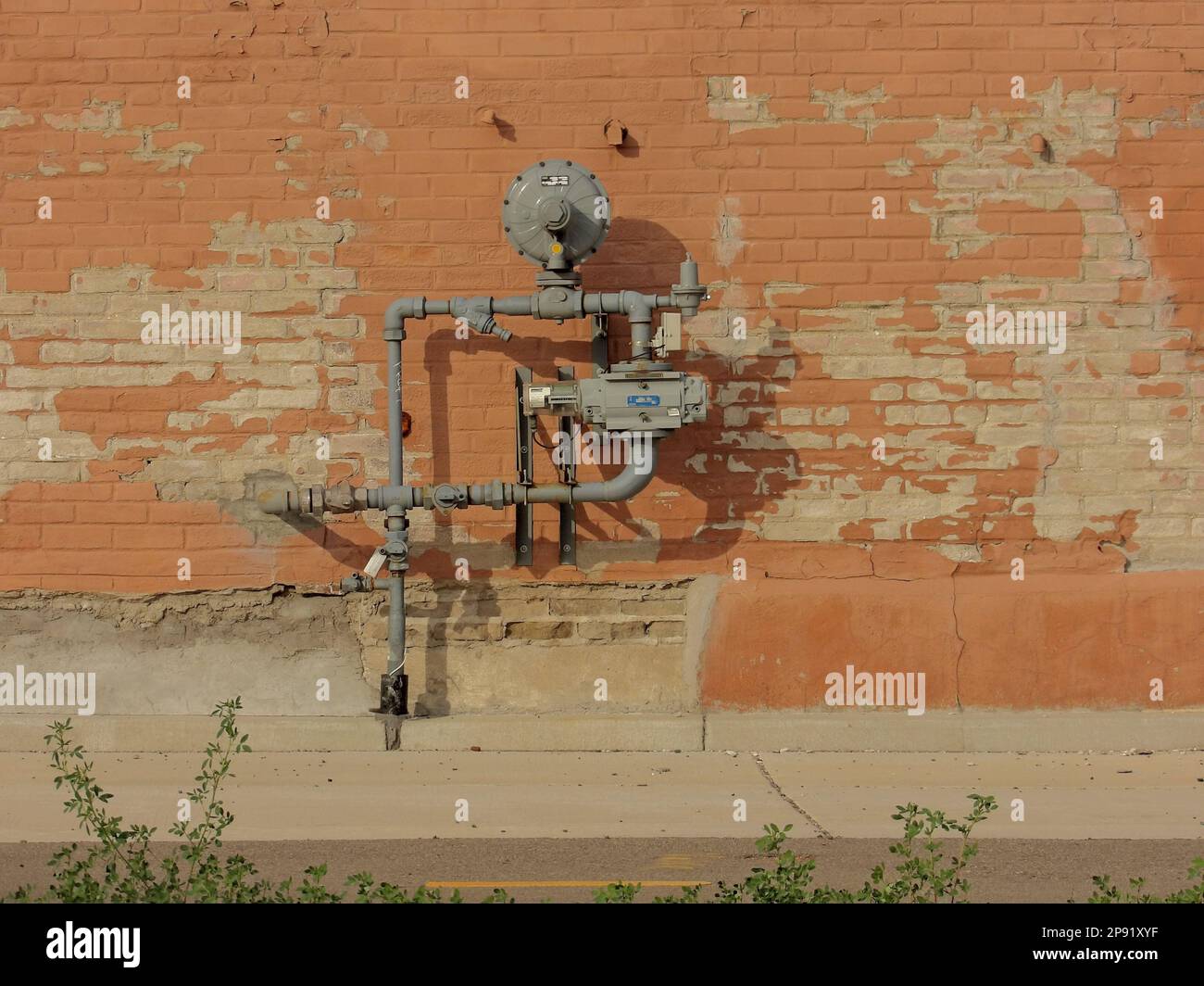 An outdoor scene featuring a traditional red fire hydrant and metal ...
