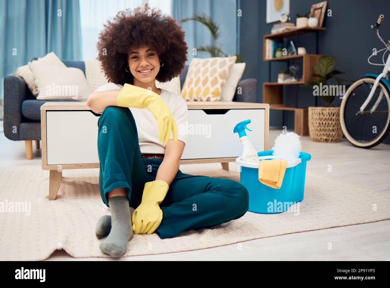 Happy black woman, cleaning living room and relax taking break from ...