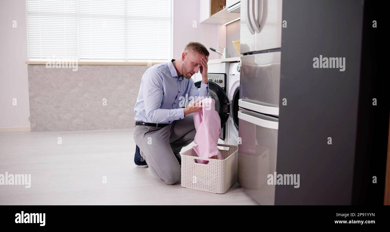 Stained Pink Clothes In Washing Machine. Laundry Cleaning Stock Photo ...