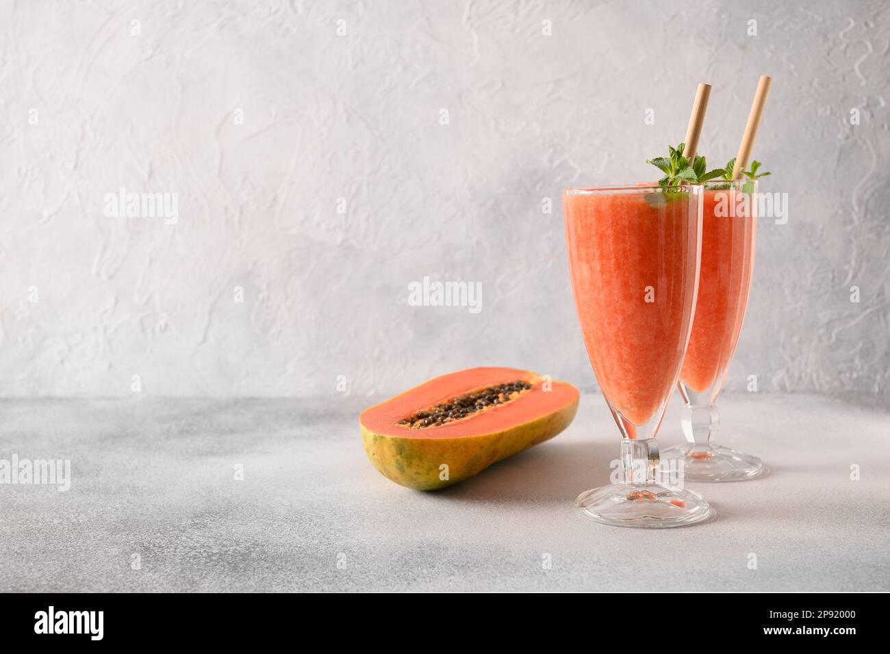 Papaya lassi or smoothie on gray background. Freshness cold beverage ...