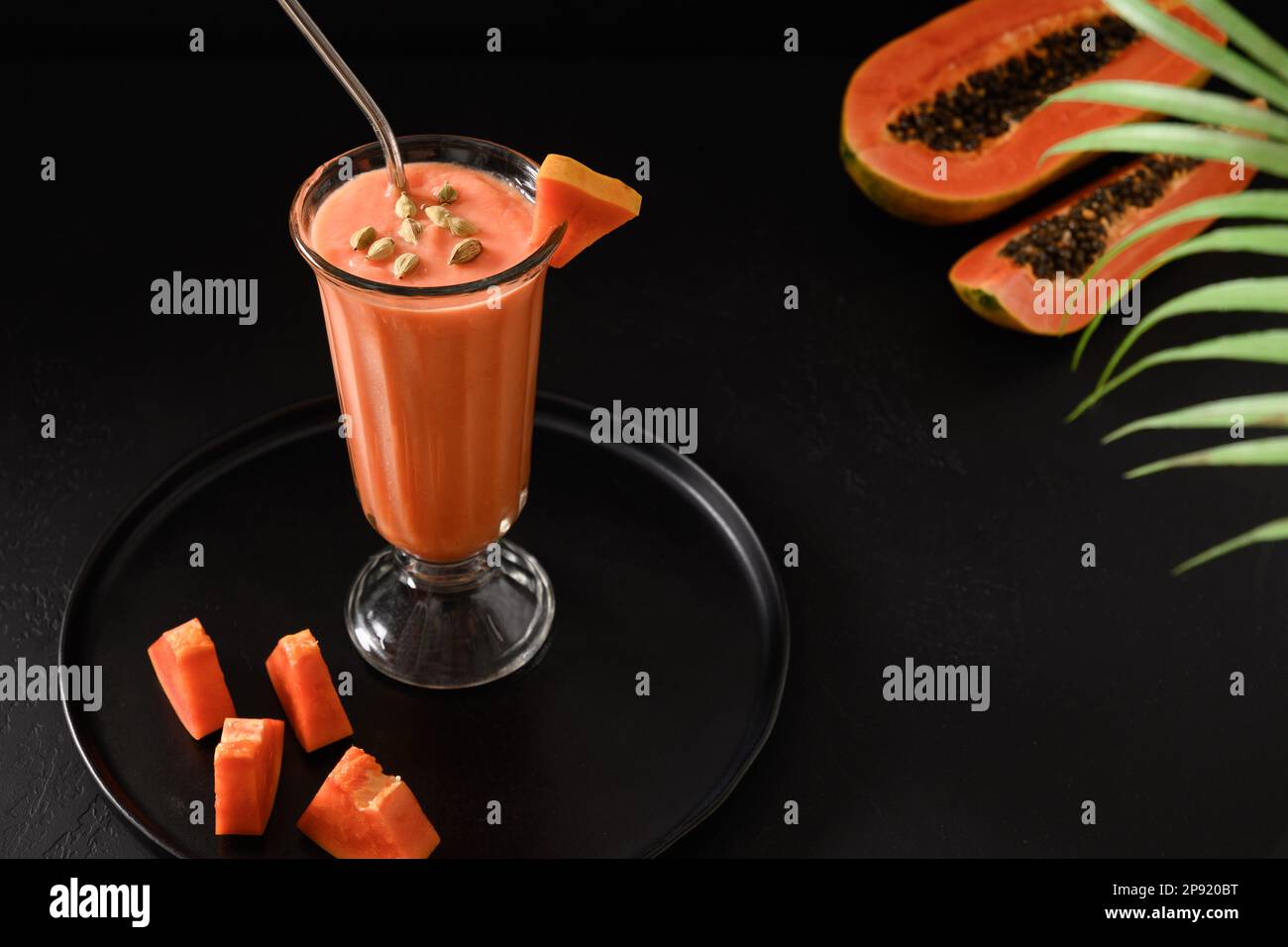 Asian traditional Papaya lassi on black background. Freshness cold ...