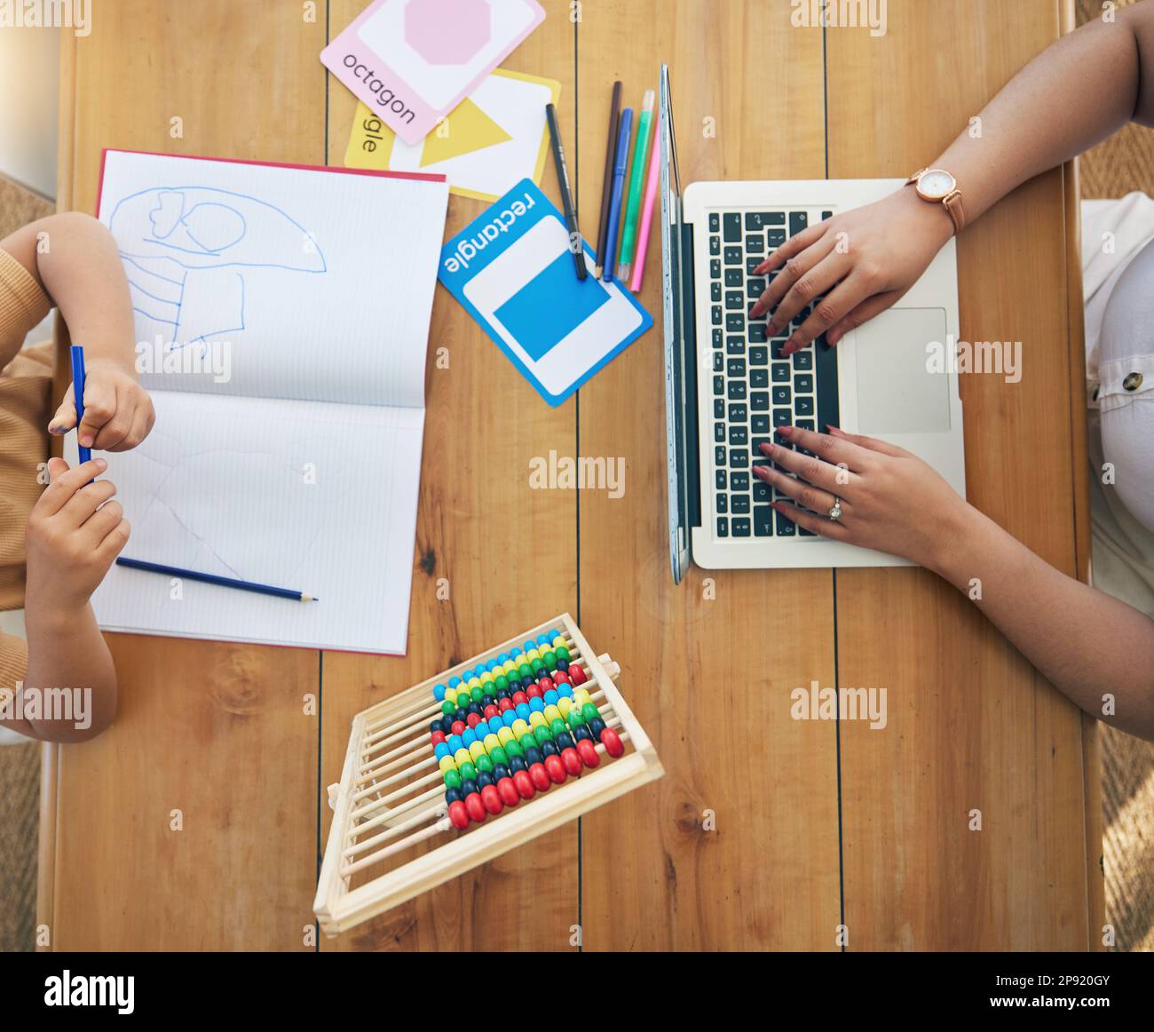 Work from home family learning from above with child writing, drawing ...