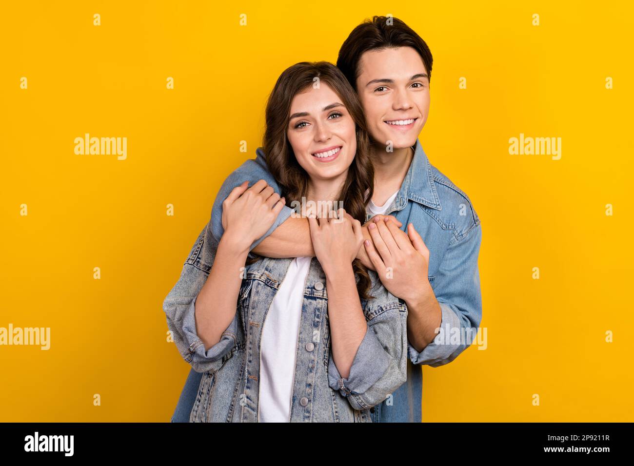 Photo of two attractive idyllic young people cuddle toothy smile ...