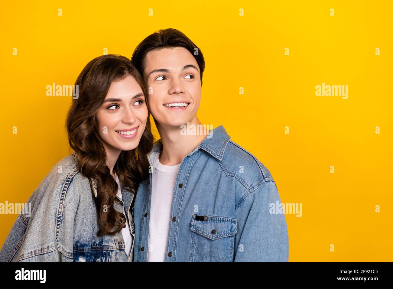 Photo of attractive girl handsome guy touch heads look empty space ...