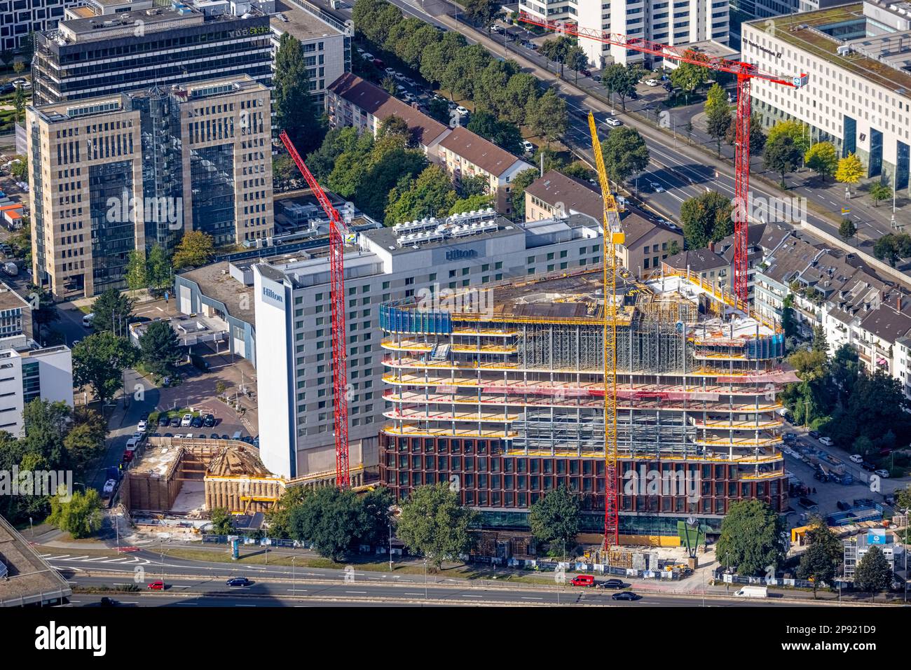 Aerial view, construction site and new building triangular office tower ...