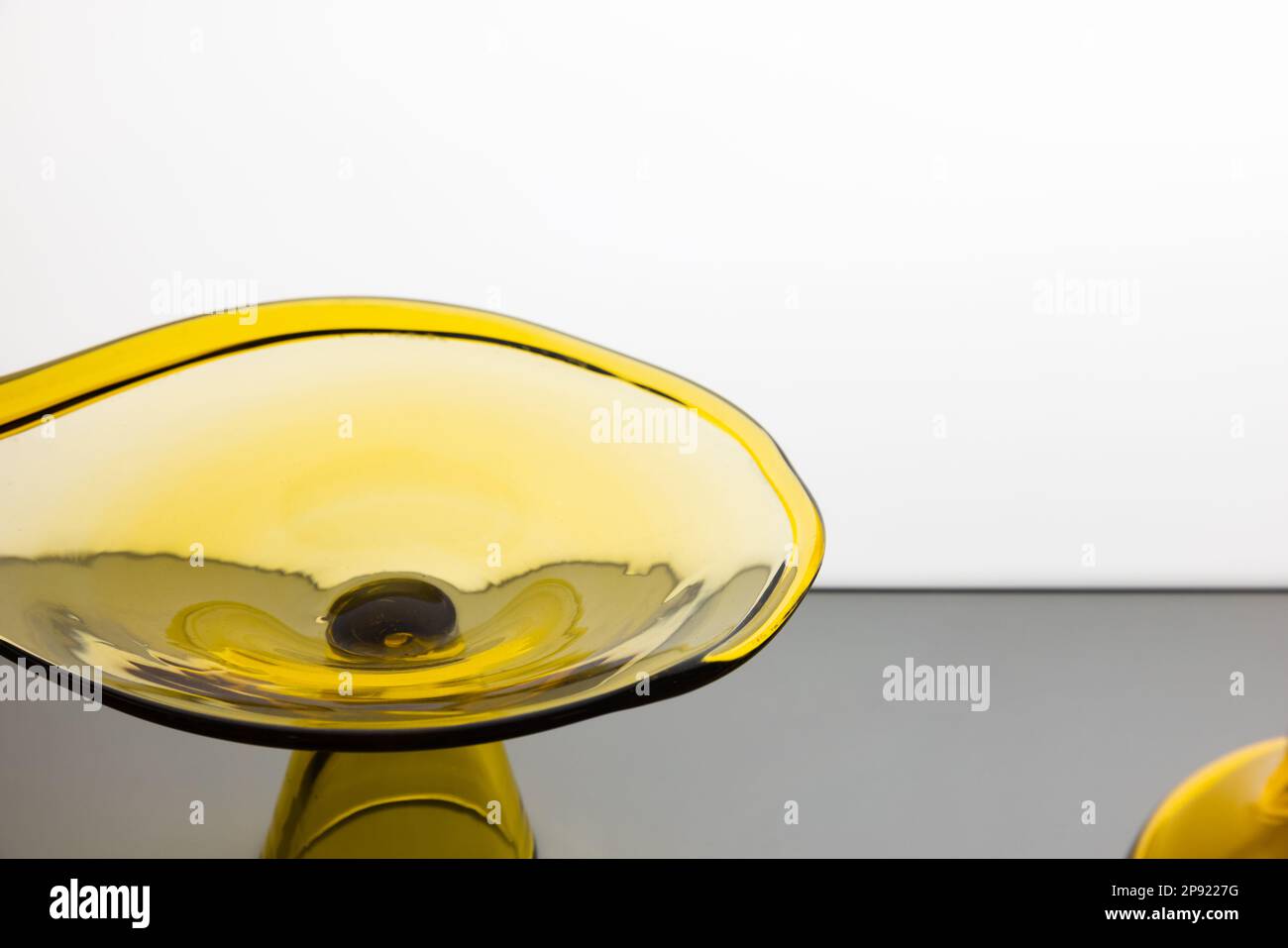 Abstract yellow glass installation, fragment of transparent decoration ...