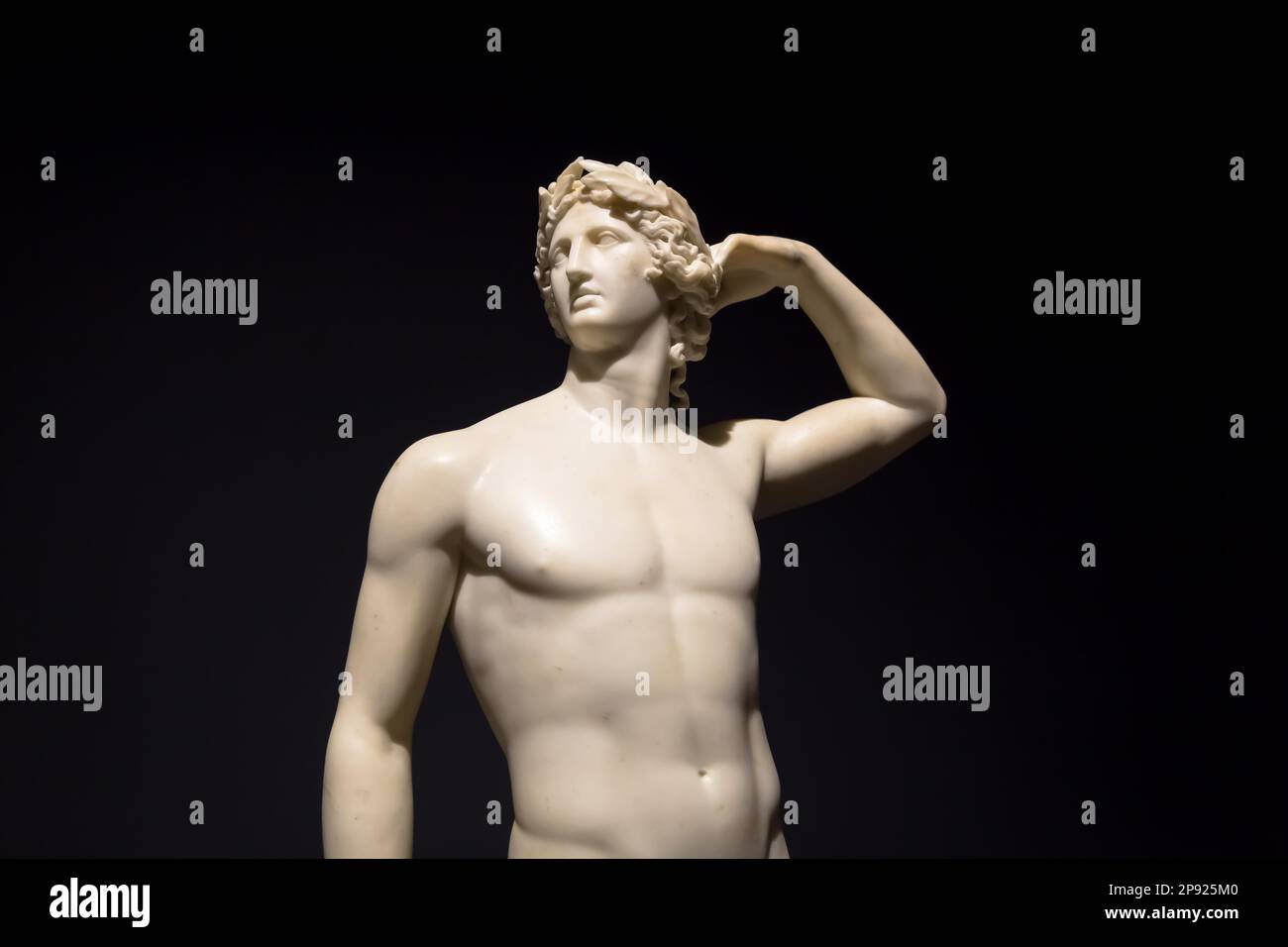 MILAN, ITALY - June 2020: the ancient sculpture Apollo Crowning Himself ...