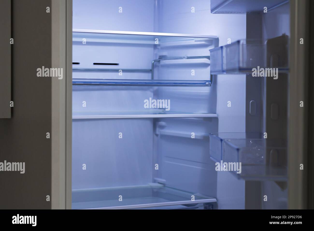 Open fridge with empty shelves, clean after defrosting refrigerator ...