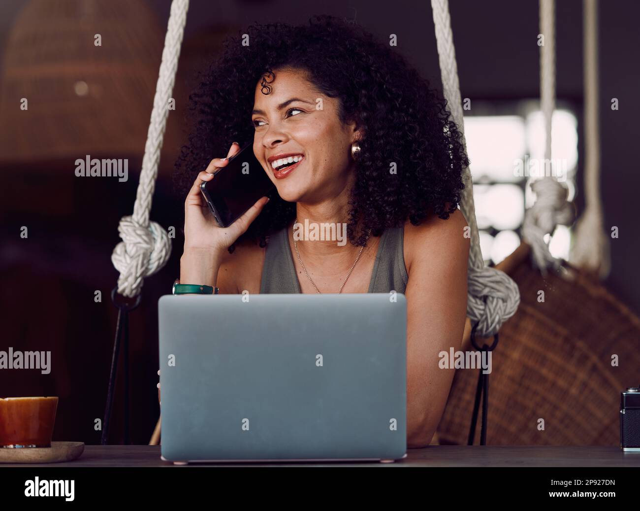 Black woman, phone call and laughing by laptop in communication ...