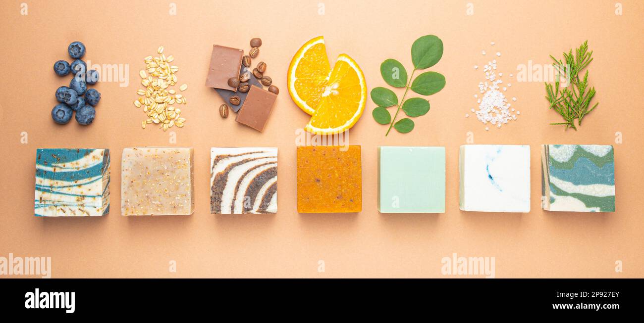 Top view of assorted variety of different handmade soap bars with ...