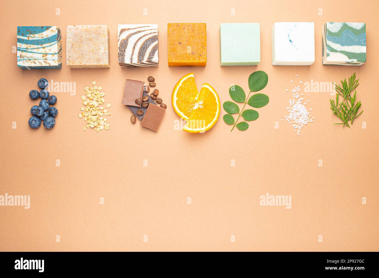 Top view of assorted variety of different handmade soap bars with ...