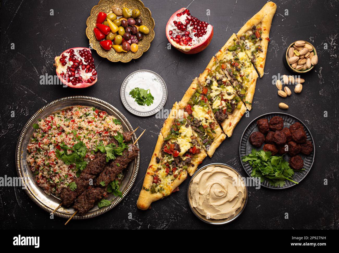 Various Turkish dishes: pide pizza, meat kebab with tabbouleh salad ...