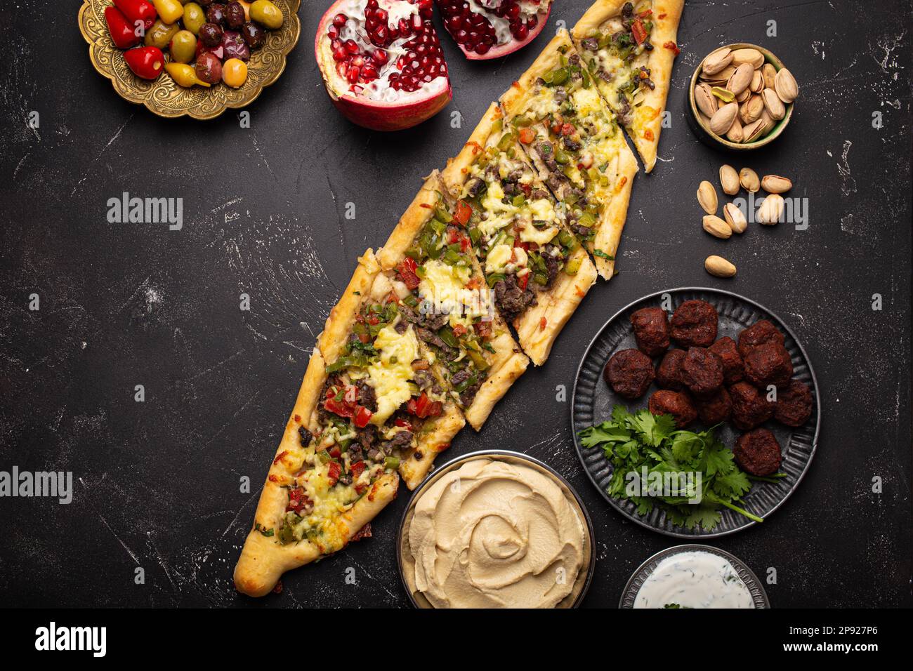 Various Turkish dishes: pide pizza, meat kebab with tabbouleh salad ...