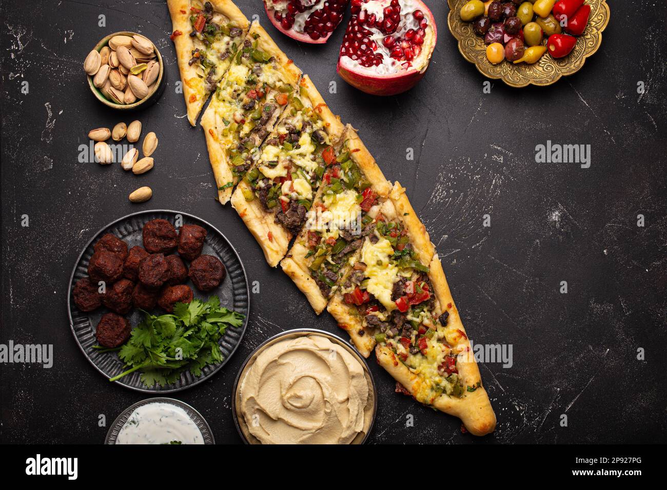 Various Turkish dishes: pide pizza, meat kebab with tabbouleh salad ...