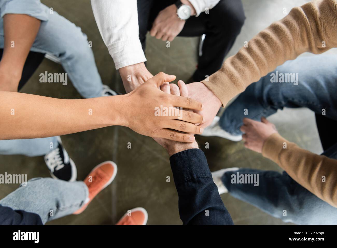 Top view of multiethnic group of people with alcohol addiction holding ...