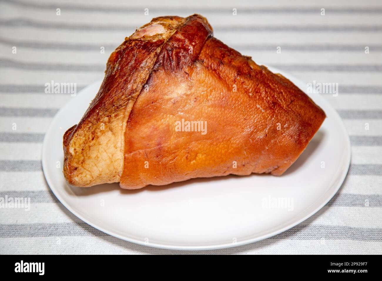 Smoked pork knuckle, traditional German dish, isolated portrait and ...