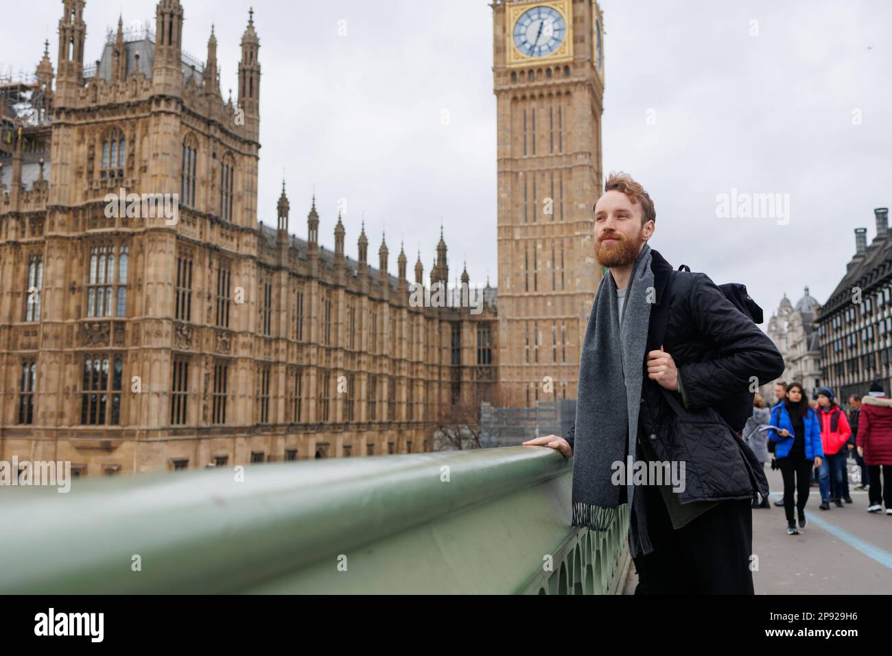 Tourist man stands on a bridge near Big Ben Tower in London Stock Photo ...