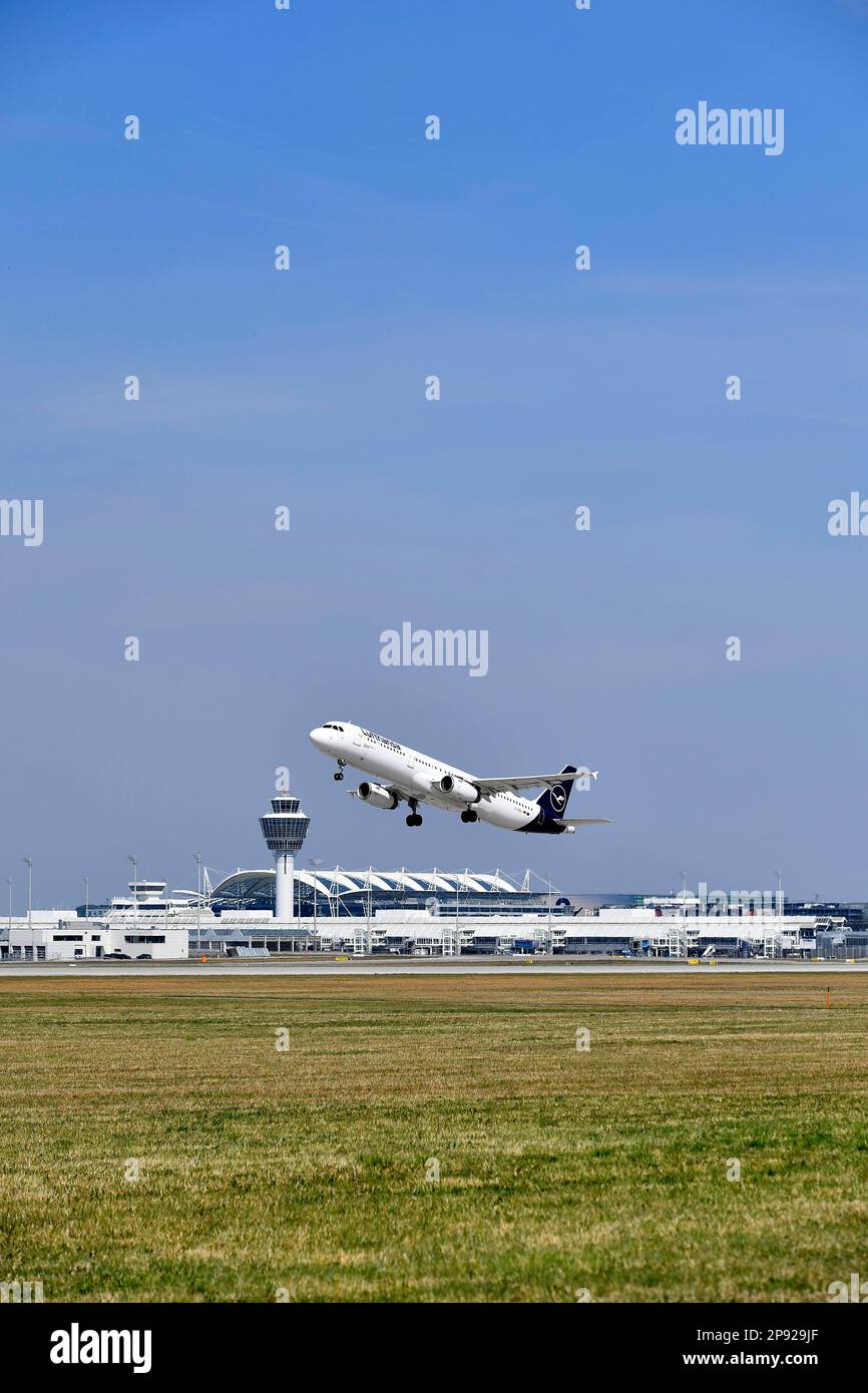 Taking off Lufthansa Airbus A320-200 on runway south with tower, Munich ...