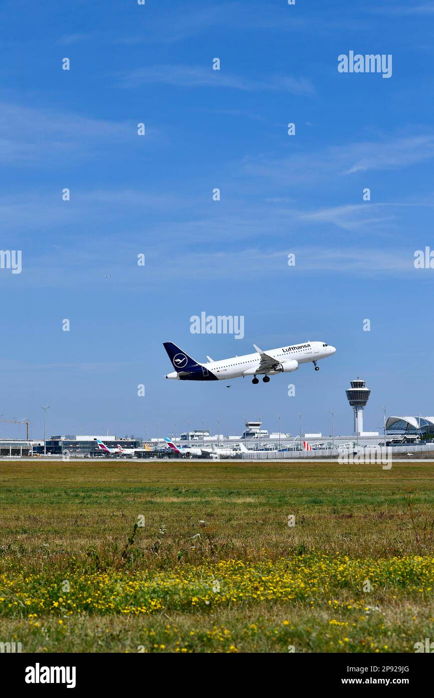 Lufthansa Airbus A320-200 taking off on runway south with tower, Munich ...