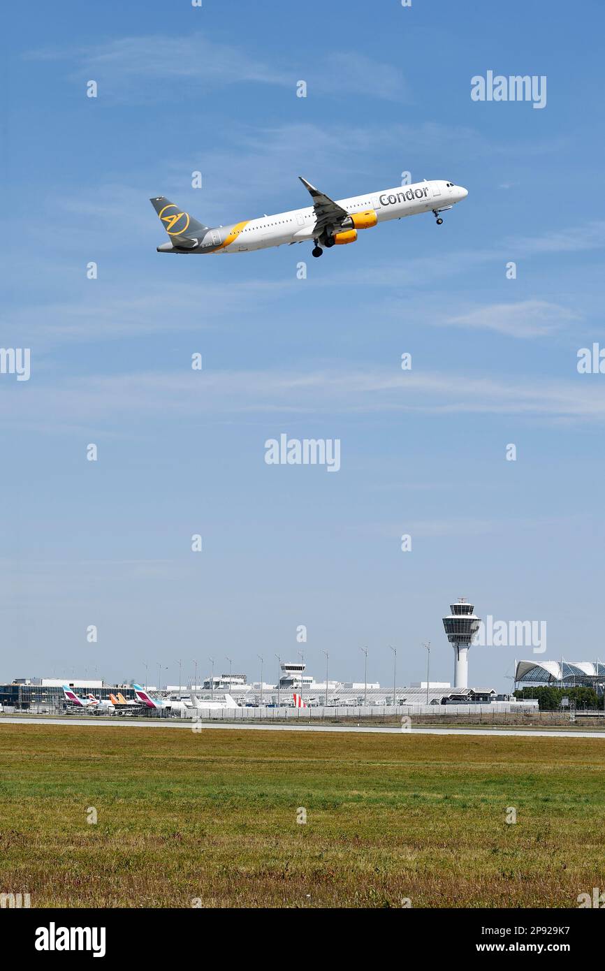 Condor Airbus A321 taking off on runway south with tower, Munich ...