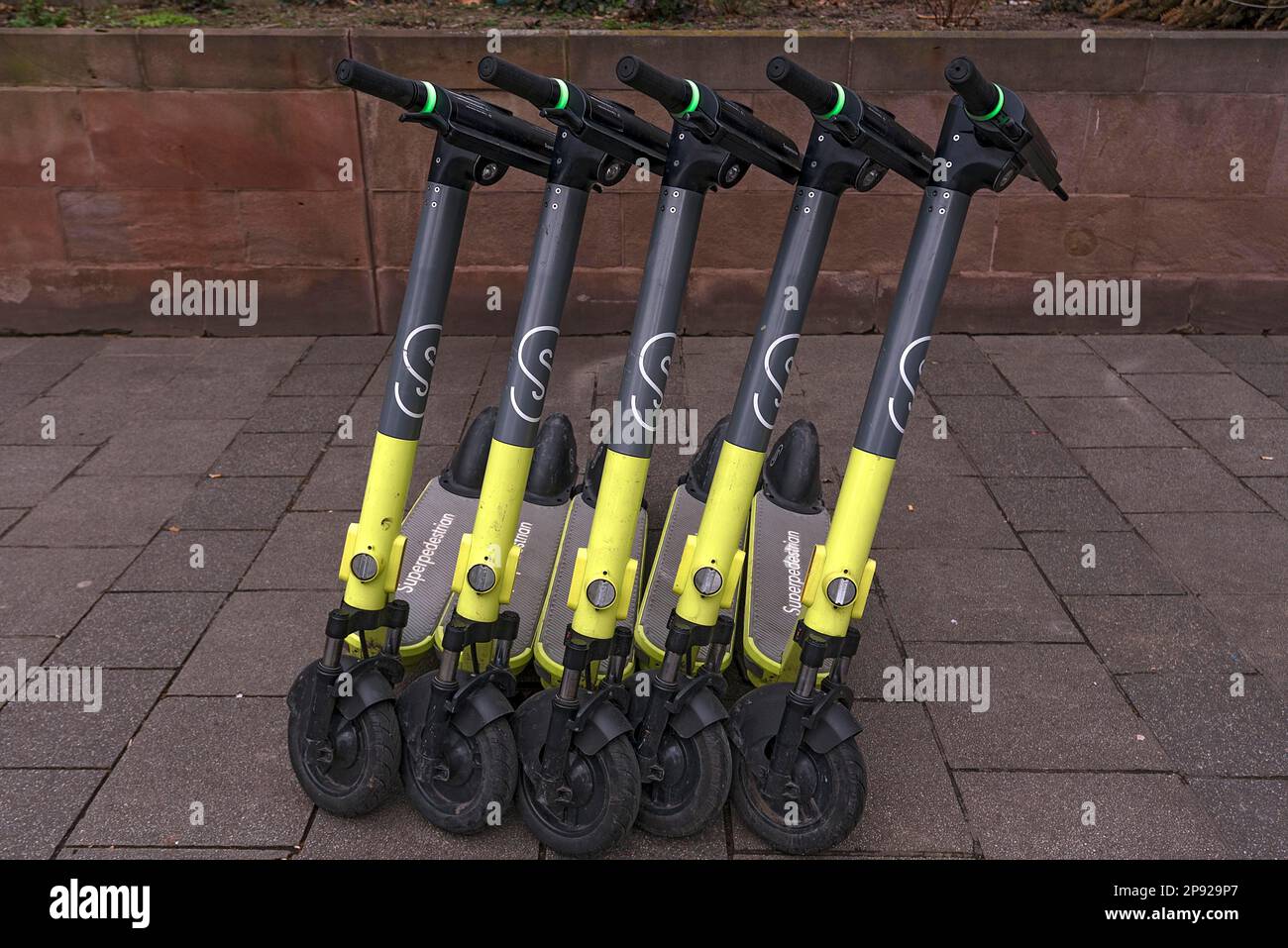 Neatly assembled electric scooters on a pavement, Nuremberg, Middle ...