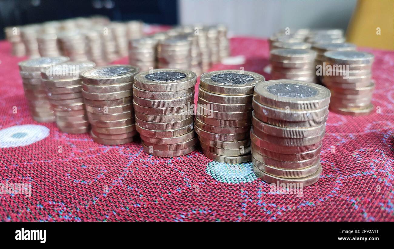 Piles pound coins hi-res stock photography and images - Alamy