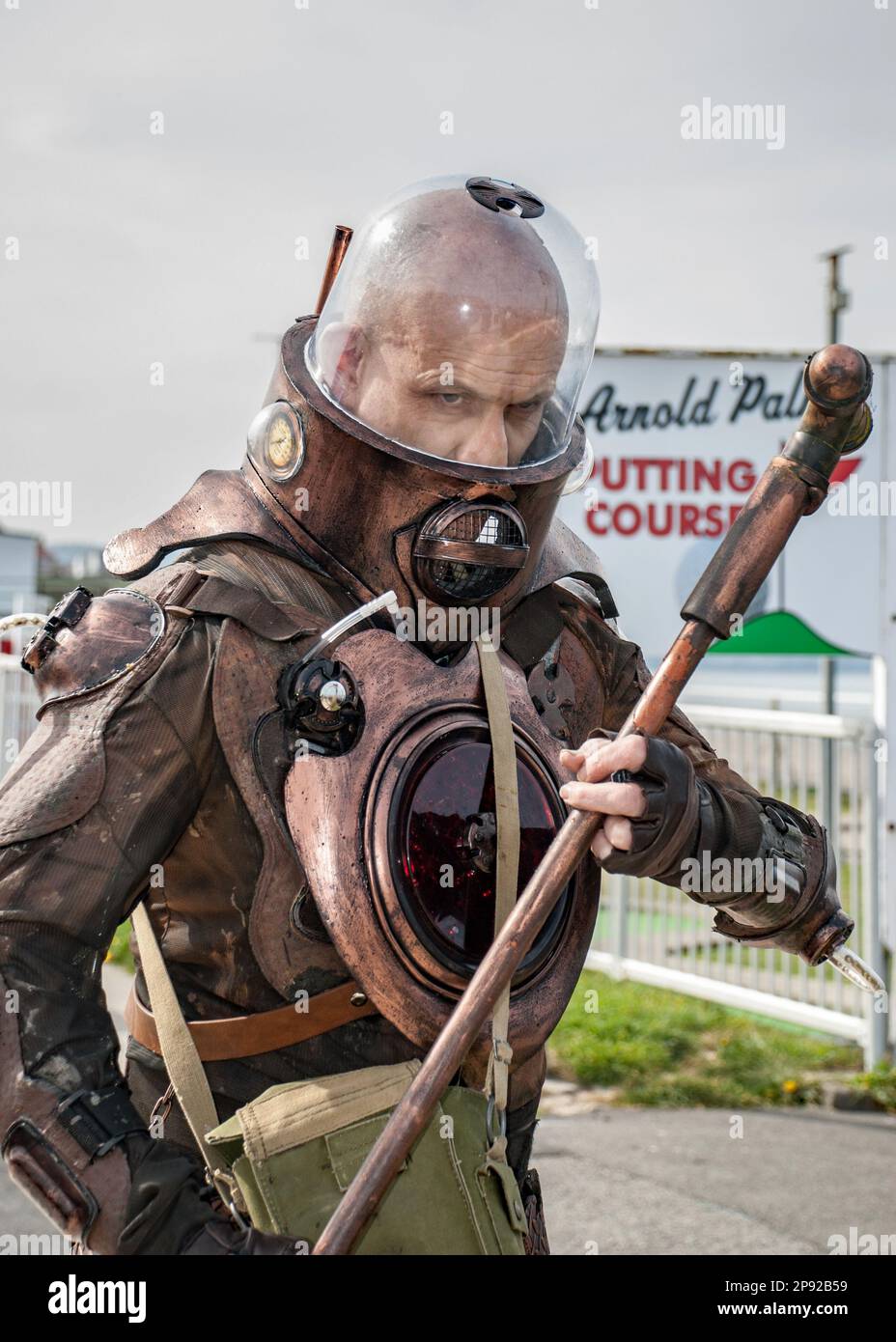 Adorned with weird paraphernalia like metal cogs hi-res stock ...