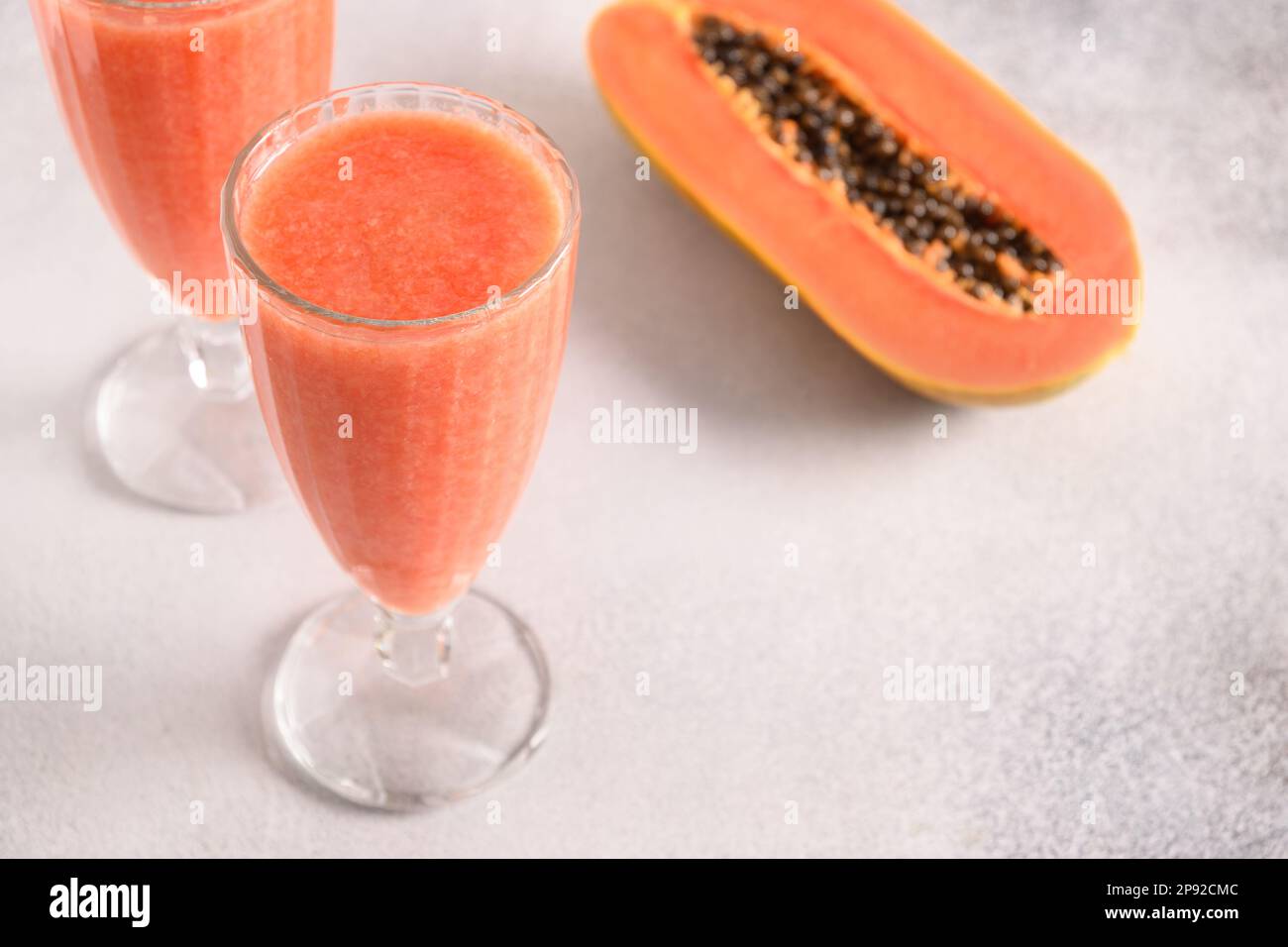 Papaya lassi or smoothie on gray background. Freshness cold beverage ...