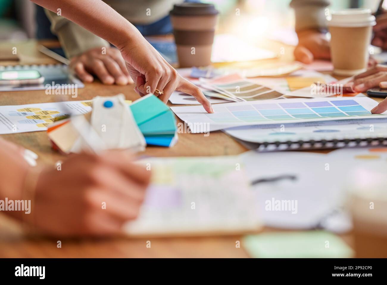Color, creative meeting and hands of business people on desk for ...
