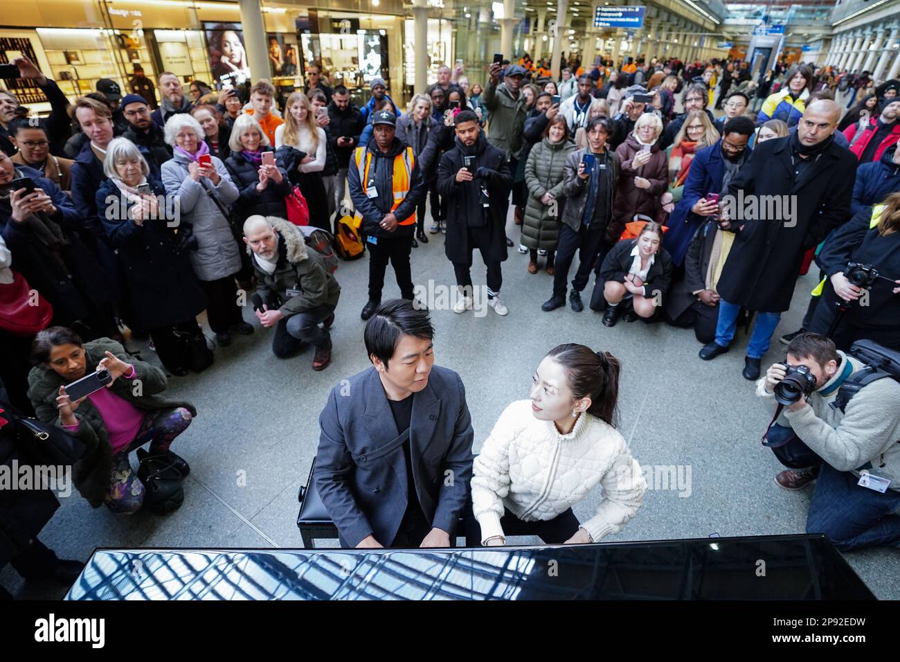 Pianist Lang Lang and his wife Gina Alice Redlinger perform on a public ...