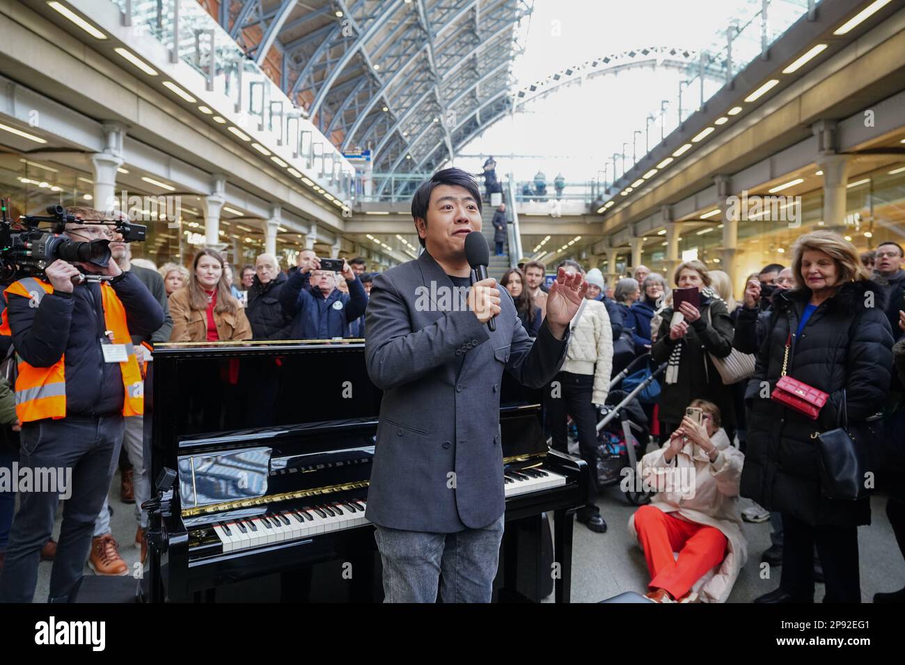 Pianist Lang Lang performs on a public piano at St Pancras Station in ...