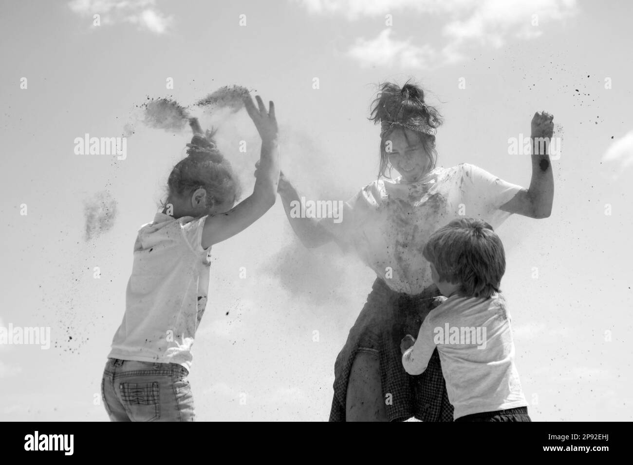 Emotional cheerful excited children with colored powder and color dust ...