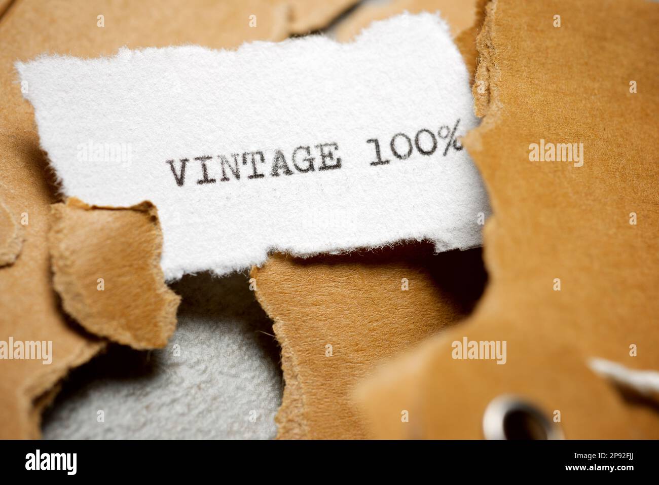 Vintage 100% text written on a small piece of paper Stock Photo - Alamy