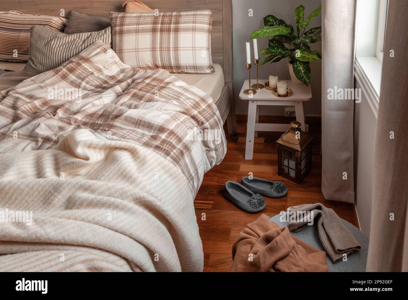 cozy scandinavian bedroom interior in natural tones, real life mess ...