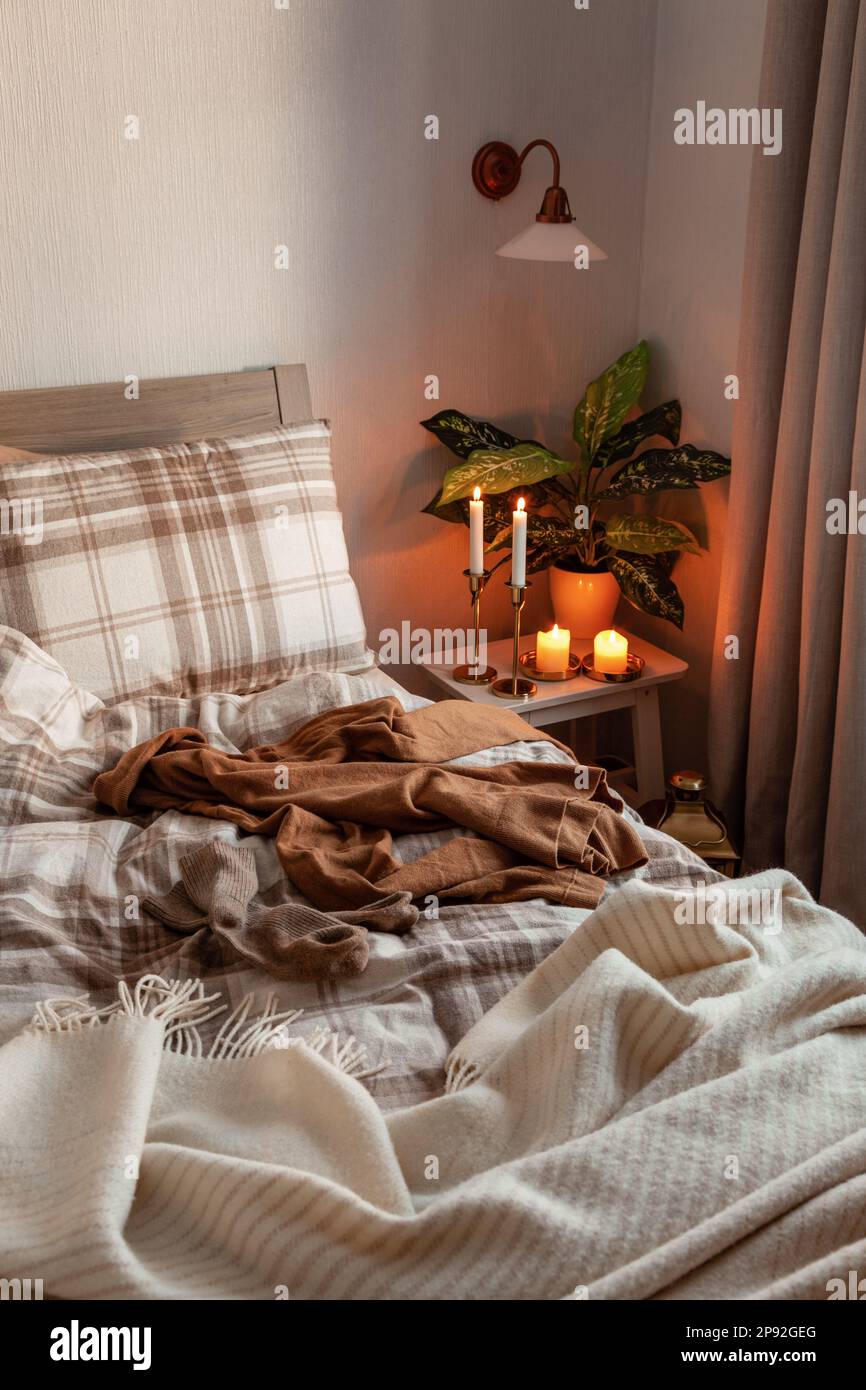 cozy scandinavian bedroom interior in natural tones, real life mess ...
