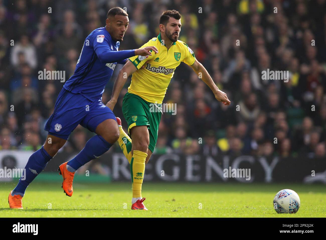 Nelson Oliveira of Norwich City battles with Kenneth Zohore of Cardiff ...