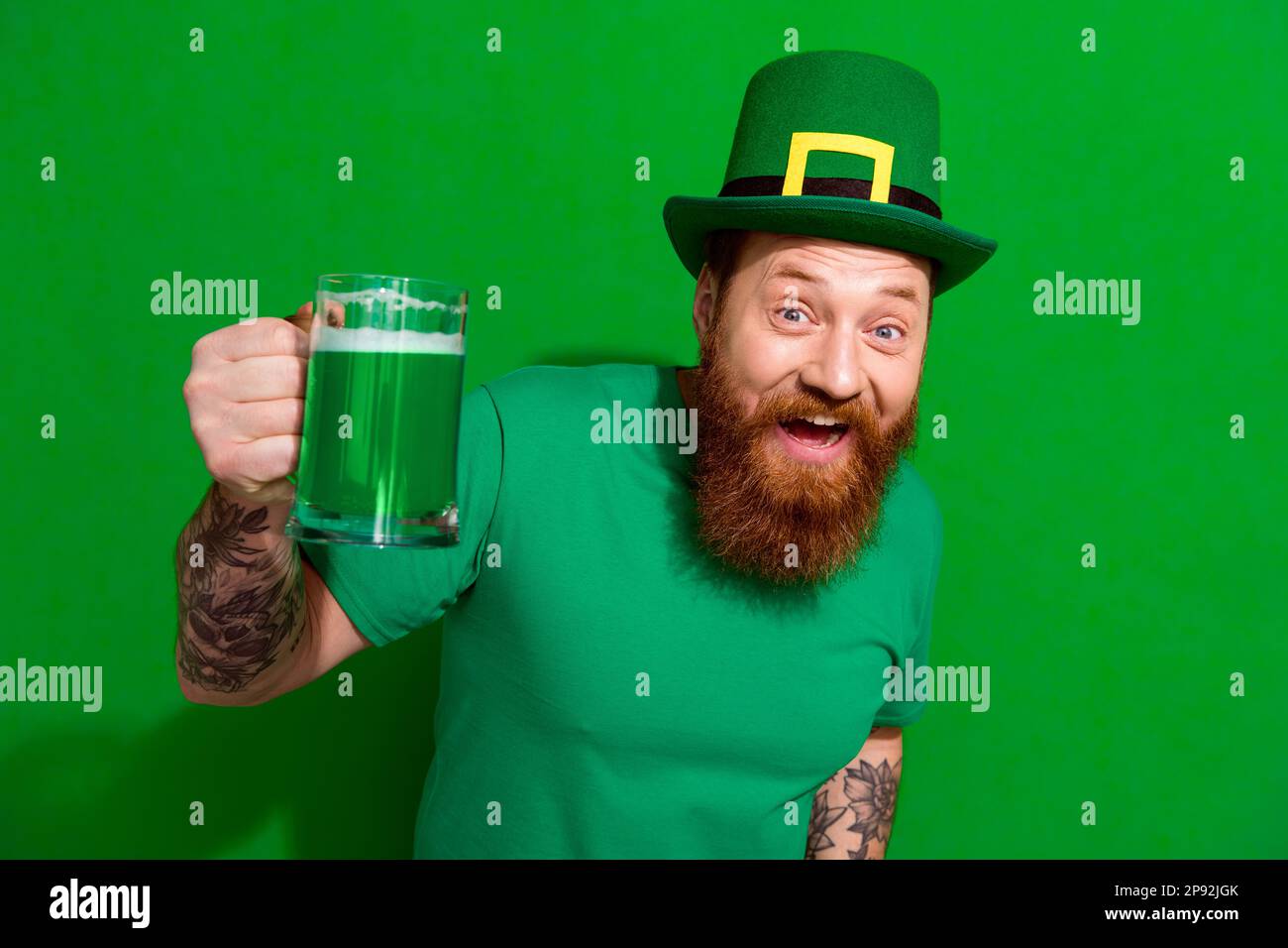 Photo of good moob guy dressed t-shirt cap rising ale beer glass ...