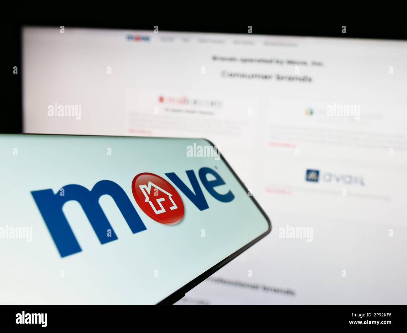 Mobile phone with logo of American real estate company Move Inc. on ...