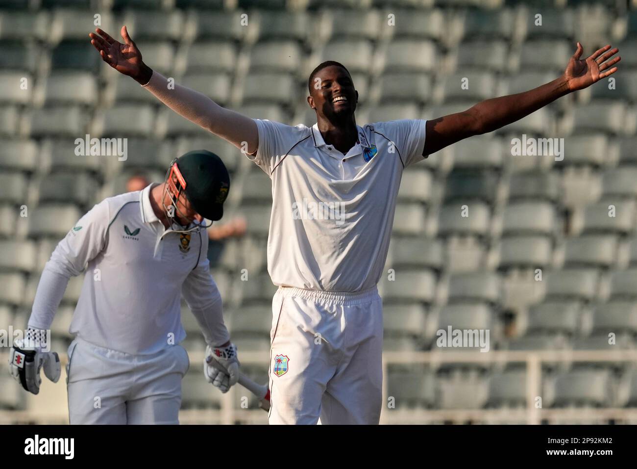 West Indies's bowler Jason Holder, right, celebrates after dismissing ...