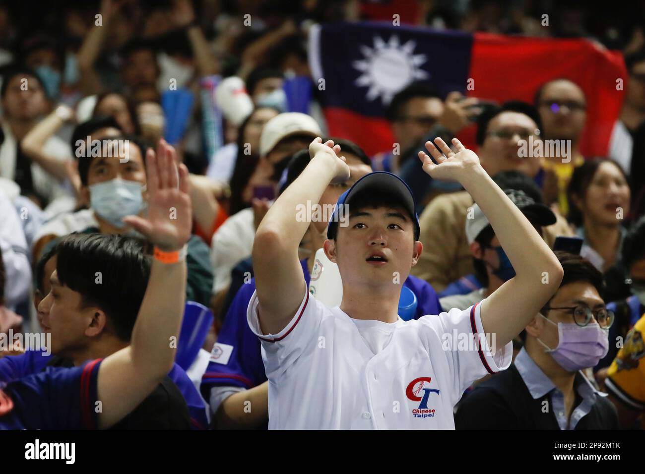 Supporters of team Taiwan cheer near a Taiwan flag during a Pool A game ...