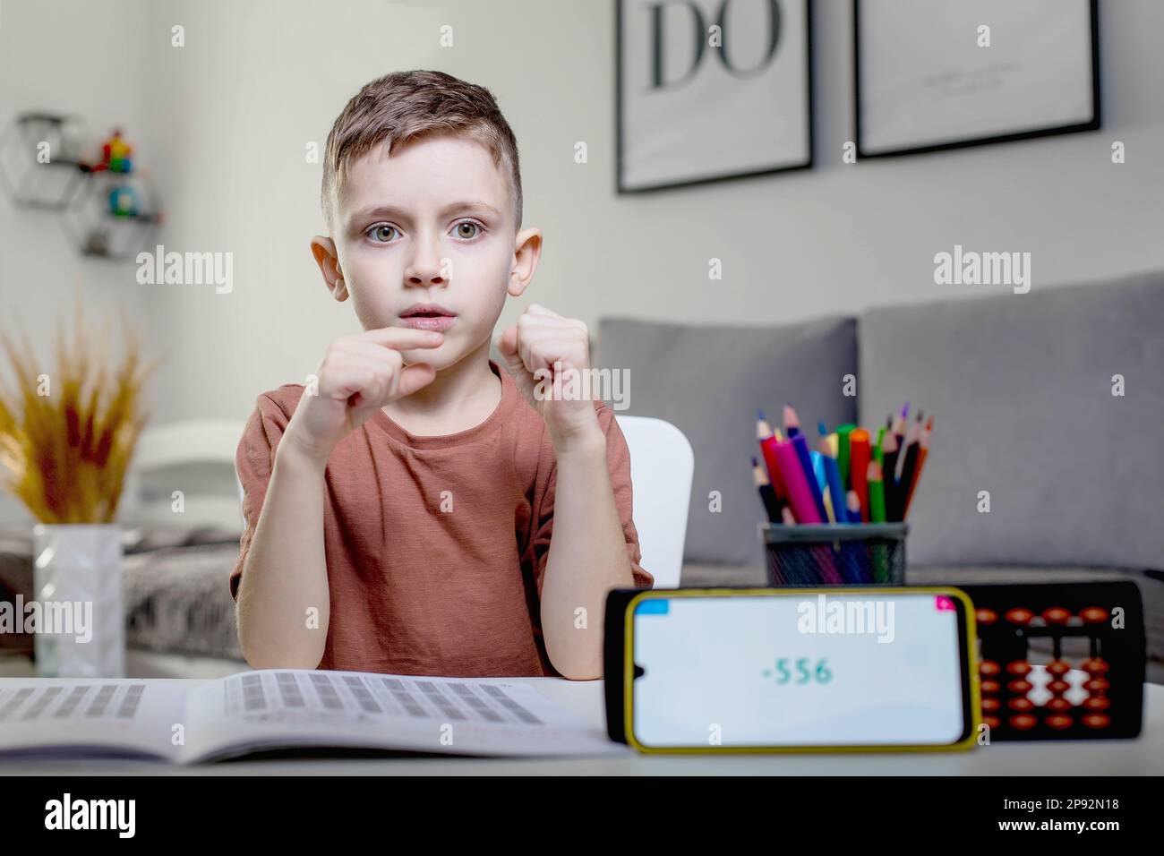 Little boy counting with the help of mental arithmetic. Mathematics in ...