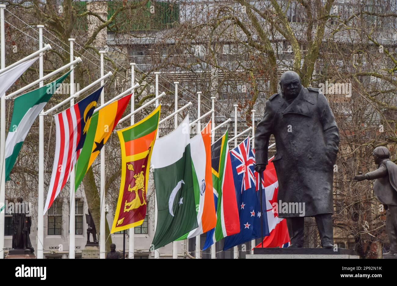 London, England, UK. 10th Mar, 2023. Winston Churchill statue and flags ...