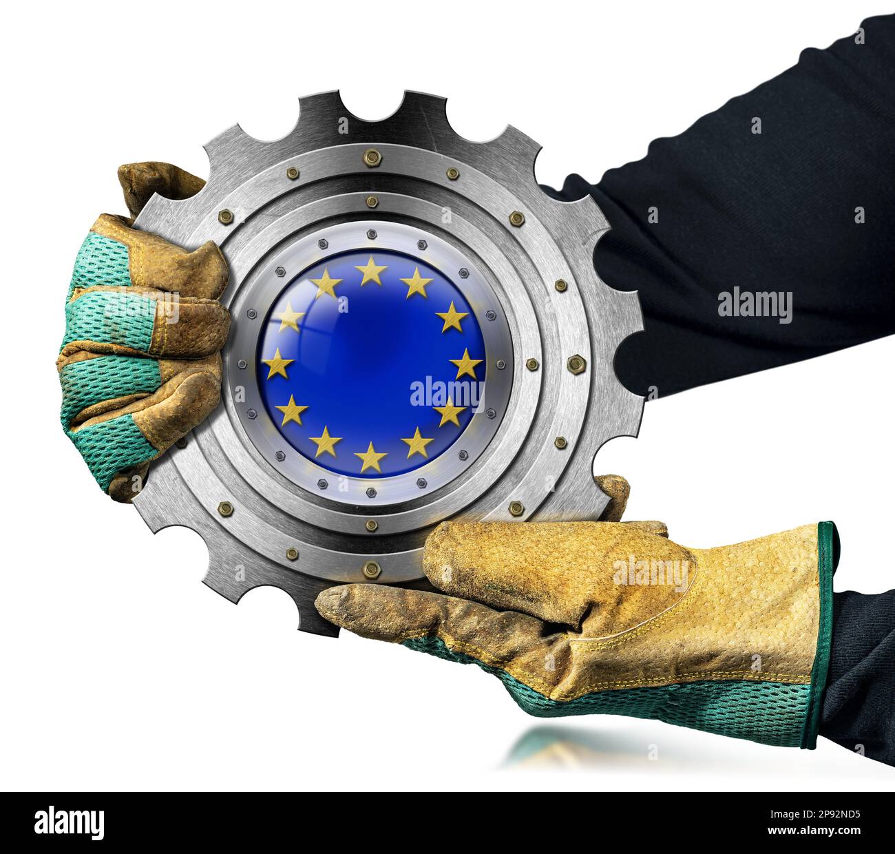 Manual worker with work gloves holding a metallic cogwheel with the ...