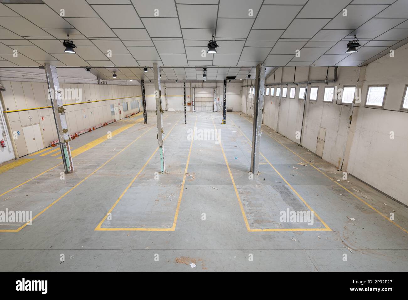 Top view of an empty auto repair shop or car park with natural light ...