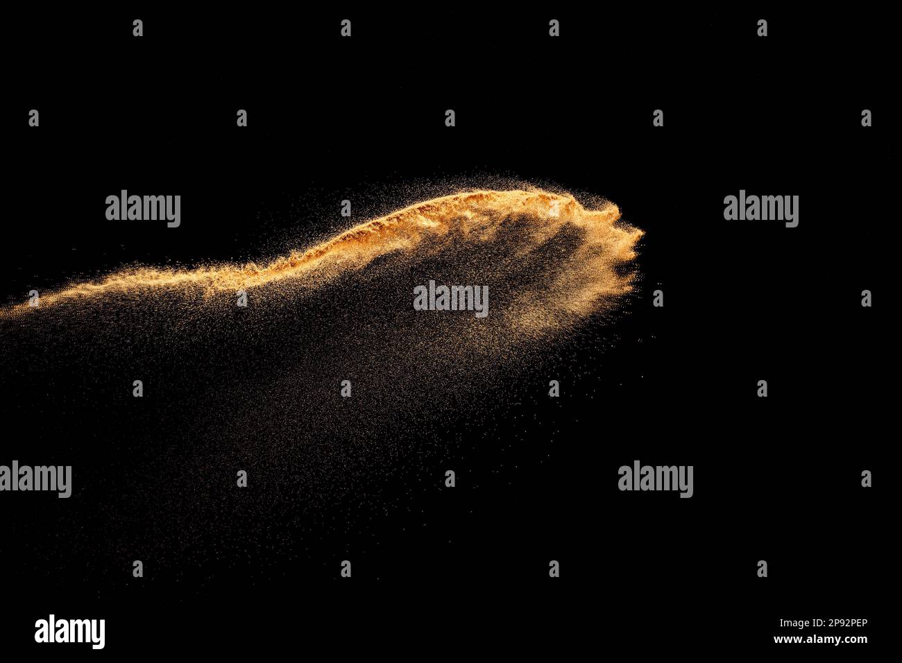 Sand explosion isolated on black background. Freeze motion of sandy ...